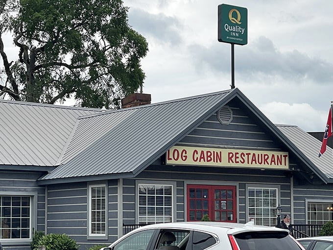 Those iconic red doors against the gray exterior aren't just welcoming – they're practically a beacon for hungry travelers seeking authentic Tennessee flavor.