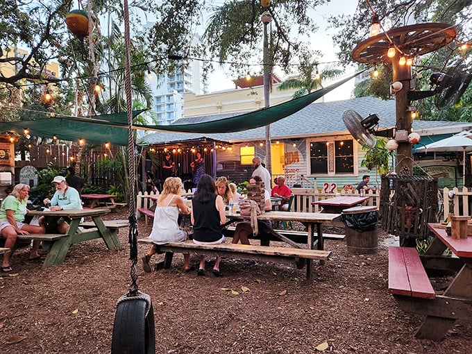 The backyard paradise you've been dreaming of – picnic tables, string lights, and seafood that'll make you forget your table manners.