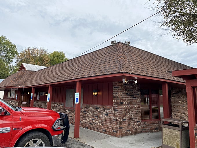 Brick and wood come together in this humble exterior that houses culinary treasures far greater than its modest appearance suggests.
