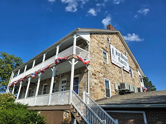 The historic stone façade of Jean Bonnet Tavern stands proudly against the Pennsylvania sky, a culinary time capsule waiting to be explored.