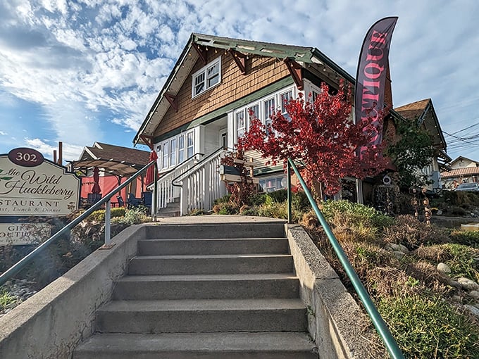 Stairway to breakfast heaven! The craftsman-style charm of The Wild Huckleberry beckons with cedar shakes and a splash of crimson foliage.