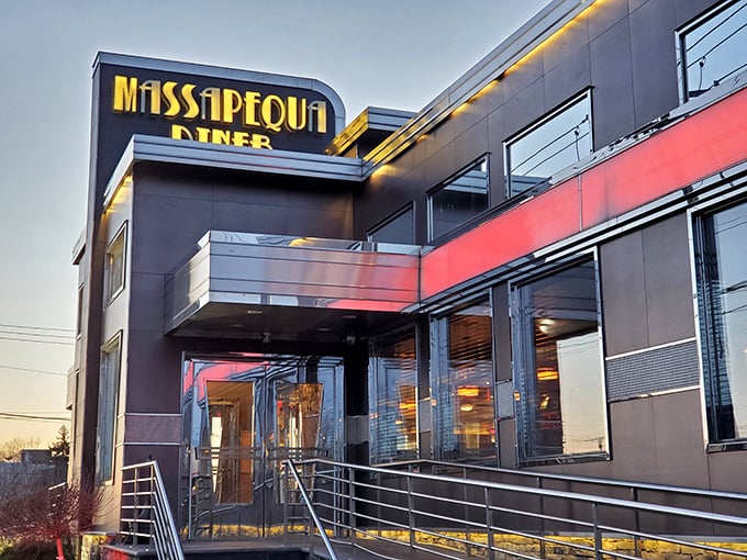 The Massapequa Diner's sleek black and red exterior isn't just eye-catching—it's a beacon for hungry souls at any hour. Modern architecture meets classic diner comfort.