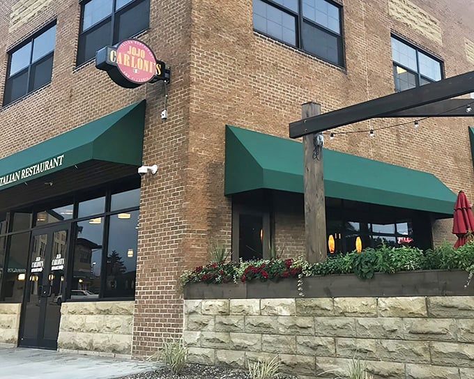 The corner entrance with its circular sign serves as a beacon for hungry travelers – a culinary lighthouse guiding pasta pilgrims home.