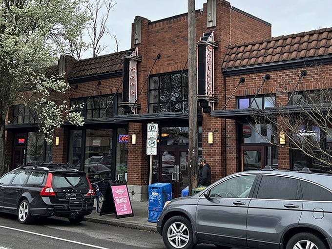 The brick exterior of Cadillac Café stands like a culinary lighthouse on Northeast Broadway, beckoning hungry Portlanders with its vintage charm.