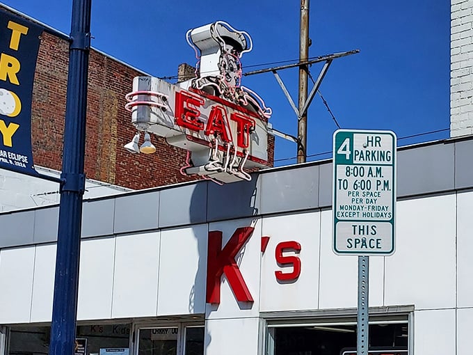 That vintage neon "EAT" sign isn't just advertising – it's a time portal to when diners were America's living rooms with better coffee.
