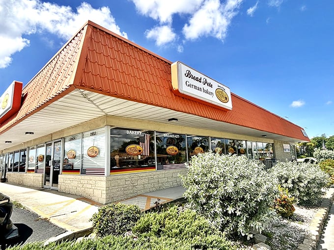 The bright orange roof of Bread Pete stands out like a culinary lighthouse, beckoning carb enthusiasts to this unassuming strip mall treasure in Cape Coral.