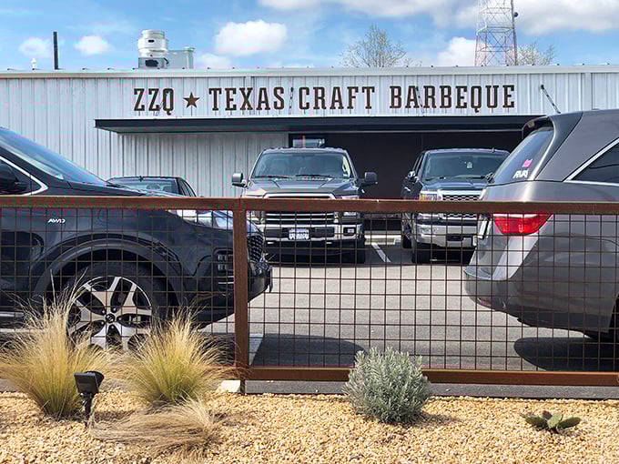 The unassuming exterior of ZZQ belies the smoky treasures within, as cars fill the parking lot—a clear sign that Texas-style barbecue has found its Virginia home.