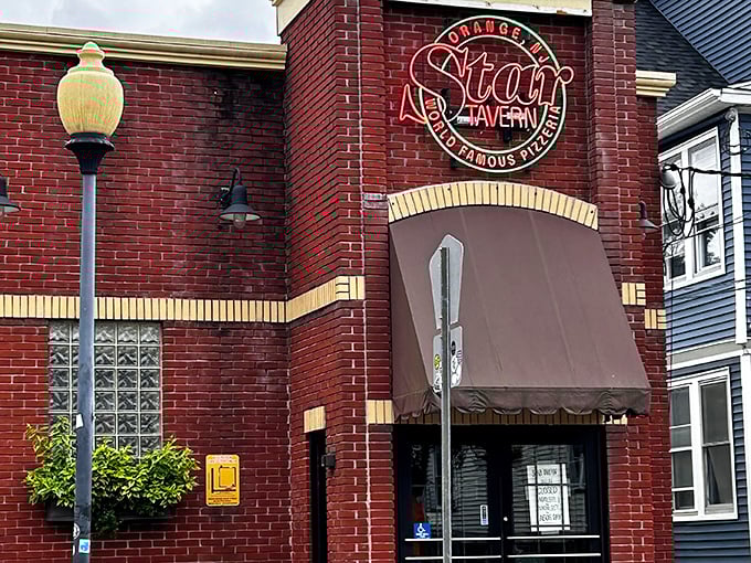 The iconic red brick exterior of Star Tavern stands like a beacon for pizza pilgrims, promising thin-crust nirvana behind its unassuming façade.