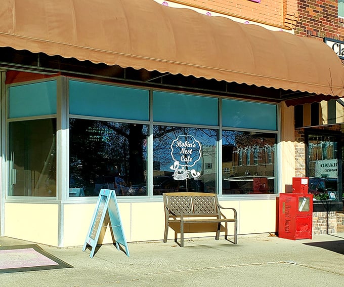 Bright pink window displays announce Robin's Nest Café like a cheerful billboard for breakfast bliss.