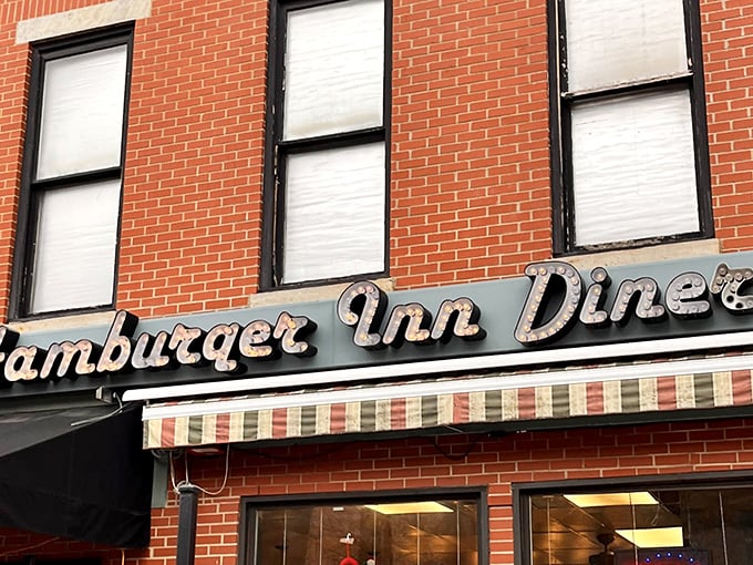 That vintage neon sign isn't just advertising – it's a beacon of hope for the burger-obsessed wandering through downtown Delaware, Ohio.