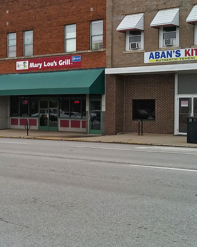 The unassuming storefront of Mary Lou's Grill stands like a beacon of breakfast hope on Carbondale's street. Green awning, red sign, pure magic inside.