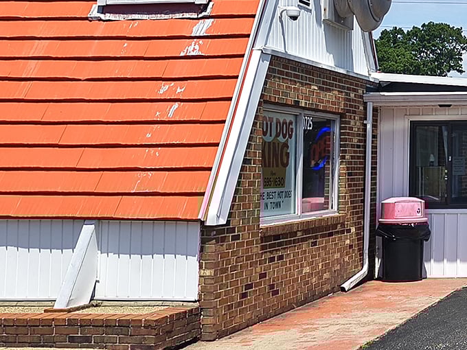 That iconic orange roof isn't just eye-catching—it's a beacon for hungry travelers, promising simple pleasures done extraordinarily well.