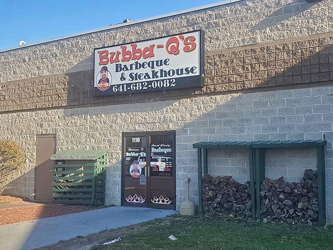 Stacked firewood flanking the entrance isn't just rustic charm—it's the first clue you've found authentic barbecue. Like a treasure map where X marks the spot for smoked meat glory.