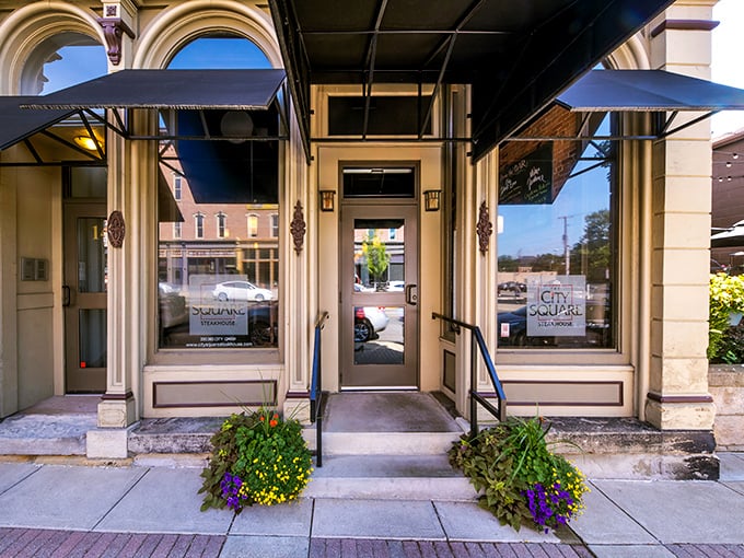 A welcoming entrance flanked by seasonal planters – your first hint that attention to detail extends from the kitchen to every corner of this establishment.