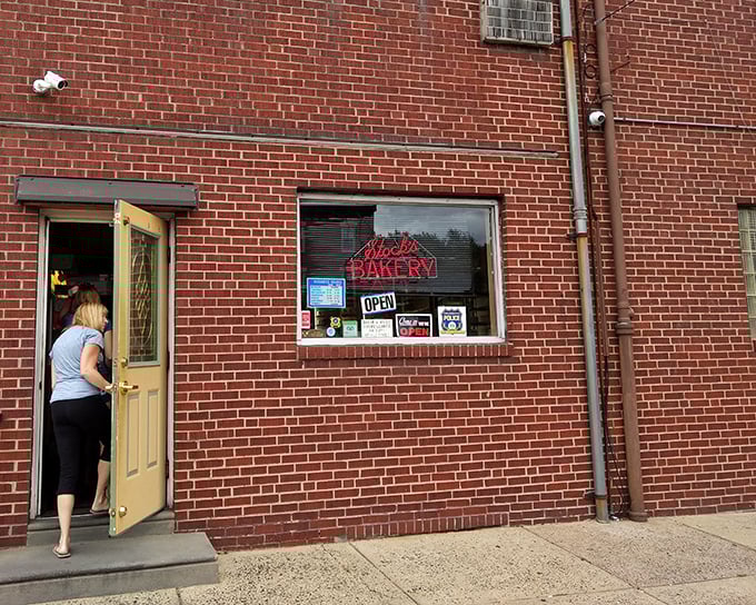 The unassuming brick exterior of Stock's Bakery hides a treasure trove of buttery delights, like a culinary speakeasy that everyone's in on.