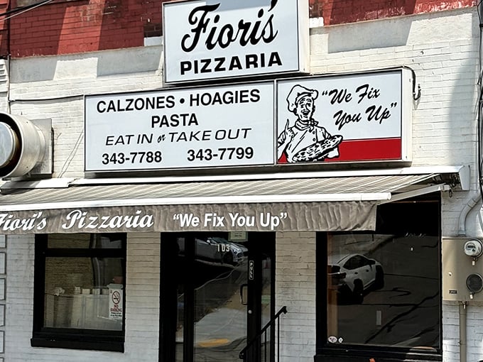 The classic storefront of Fiori's Pizzaria promises culinary salvation with its charming "We Fix You Up" slogan – Pittsburgh's version of pizza therapy.