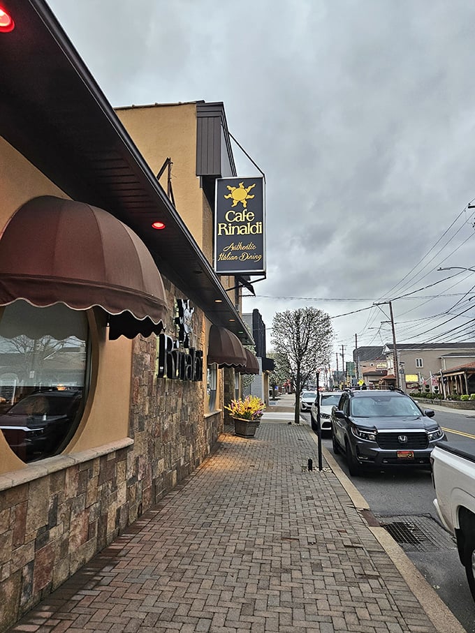 The classic stone façade and distinctive brown awnings of Café Rinaldi invite you into Old Forge's Italian treasure, promising authentic flavors behind those doors.