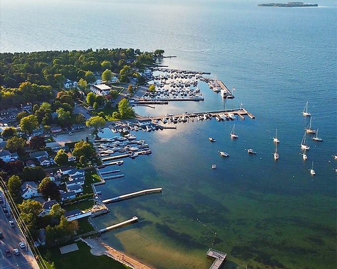 From above, Fish Creek unfolds like a watercolor painting – boats dotting the harbor like confetti while the town nestles between forest and shore.