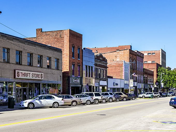 Historic brick buildings line Ashtabula's Main Street, where small-town charm meets big-time affordability. The thrift store promises treasures that won't dent your Social Security check.