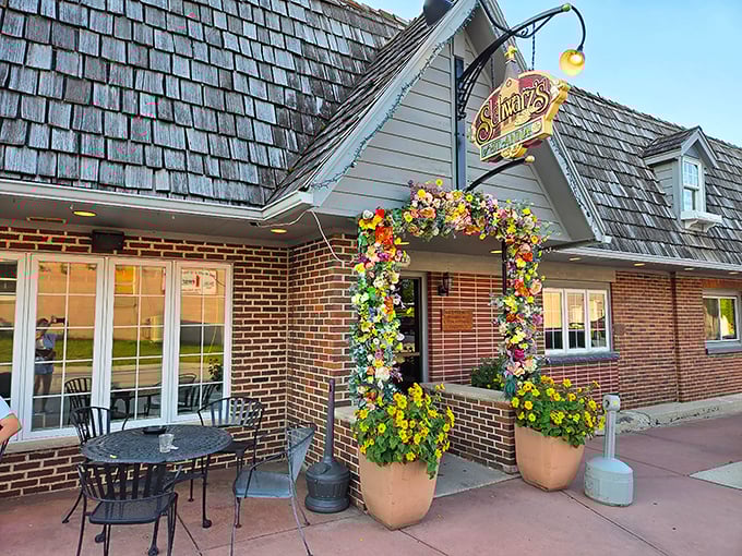 The floral archway at Schwarz's isn't just decoration—it's a portal to prime rib paradise. Wisconsin supper club magic awaits beyond those blooms.