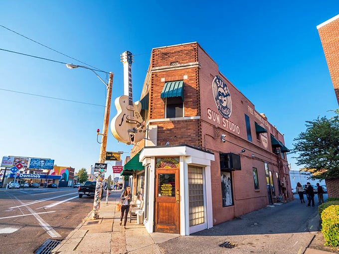 Sun Studio's iconic guitar sign beckons music lovers like a siren call. Wait, this isn't Trumann – it's Memphis, just a day trip away!