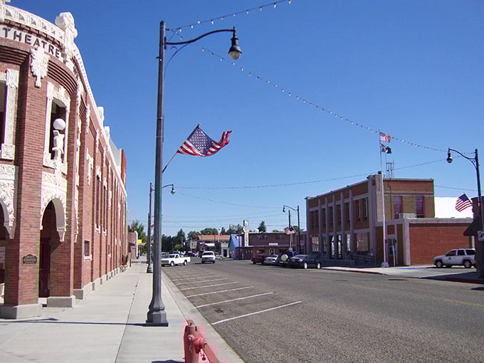 The historic Wilson Theatre anchors Rupert's town square, its brick façade standing proud like a sentinel guarding affordable small-town charm.