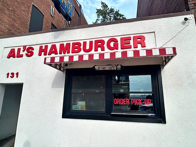 The iconic red and white striped awning of Al's Hamburger stands as a beacon of hope for the burger-deprived souls of downtown Green Bay.