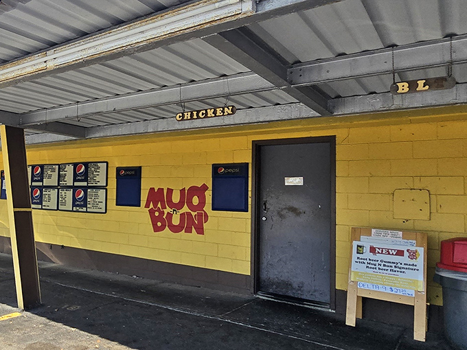 That yellow wall isn't just paint – it's a beacon calling hungry souls to drive-in paradise.