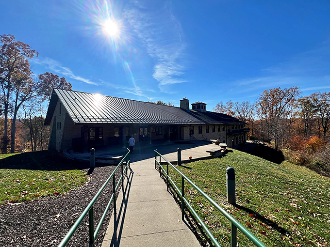 Approaching the lodge feels like discovering a secret retreat, where sunlight dances off the metal roof and hiking trails beckon from beyond the railings.