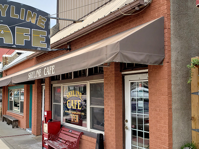 The brick facade of Skyline Café stands as a beacon of breakfast hope on Mena's main street, promising comfort food and conversations.