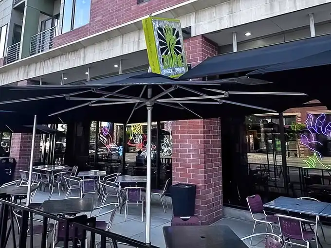 The unassuming exterior hides culinary madness within. Like finding a portal to flavor town behind a brick façade in Des Moines' East Village.