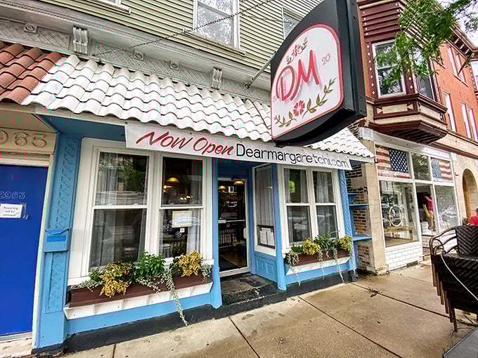 That charming blue-trimmed storefront isn't just easy on the eyes—it's your gateway to French bistro heaven in Lincoln Square.