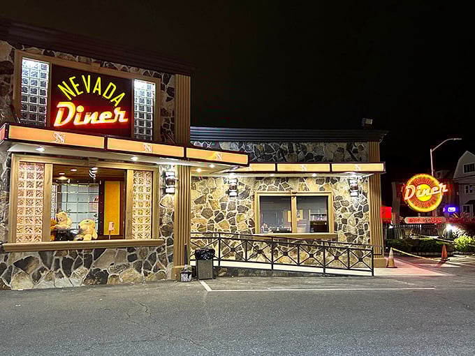 The neon glow of Nevada Diner's sign against its stone facade is like a lighthouse for hungry travelers on Bloomfield's Broad Street. Classic Jersey diner perfection.