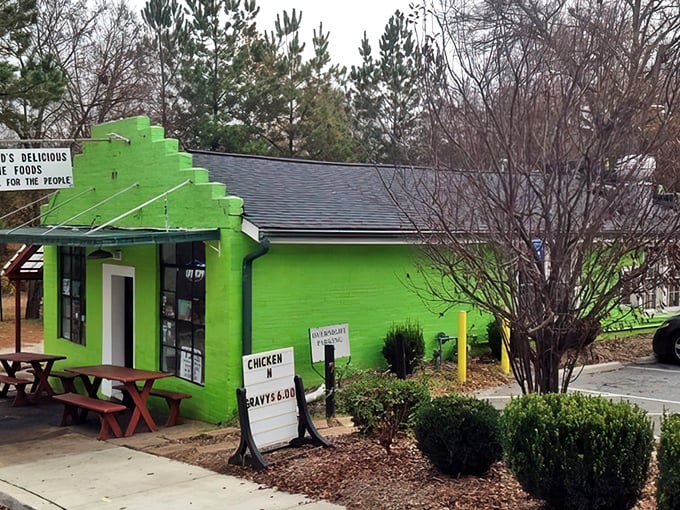 That electric lime-green exterior isn’t just eye-catching—it’s a promise of soul food magic inside. Comfort classics, bold flavors, and paradise served hot!