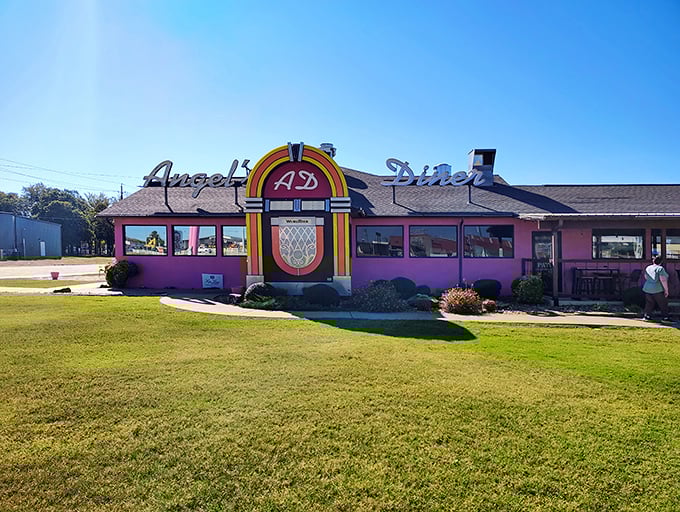 Angel's Diner's vibrant pink exterior with its jukebox-inspired entrance isn't just eye-catching—it's a time machine disguised as a restaurant in McAlester.