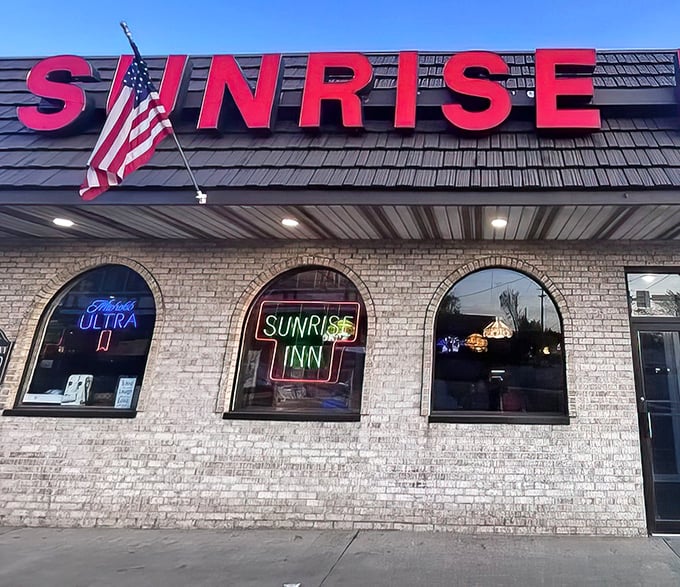 As dusk approaches, the neon Sunrise Inn sign glows with promise – the universal signal for "good food lives here."