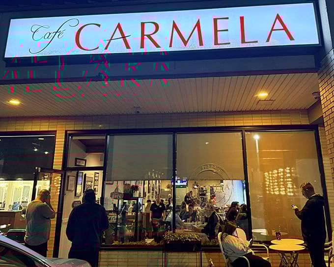 The glowing sign beckons like a lighthouse for the hungry. At night, Cafe Carmela transforms into Philadelphia's worst-kept Italian secret.