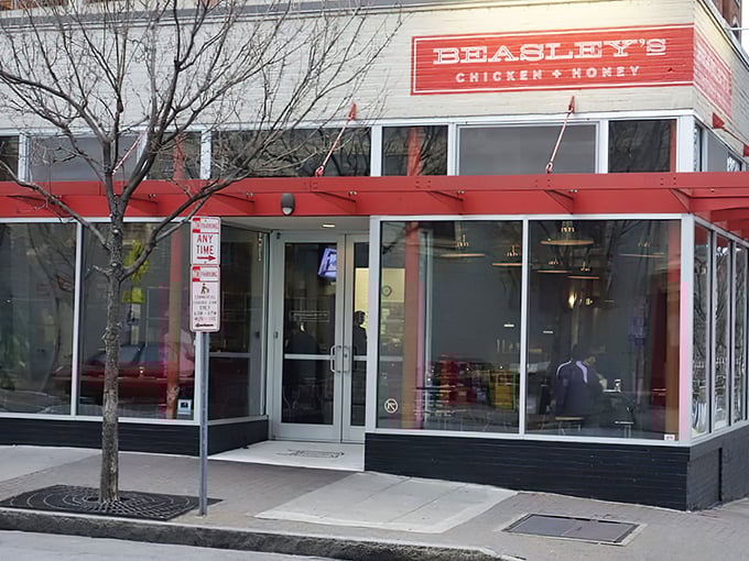 The iconic red awning of Beasley's welcomes hungry visitors like a beacon of fried chicken salvation in downtown Raleigh.