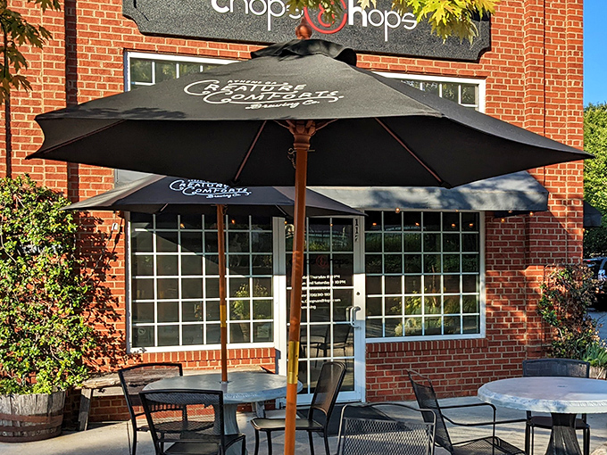 Those umbrellas aren't just for shade – they're protecting diners from food envy passing by on the sidewalk.
