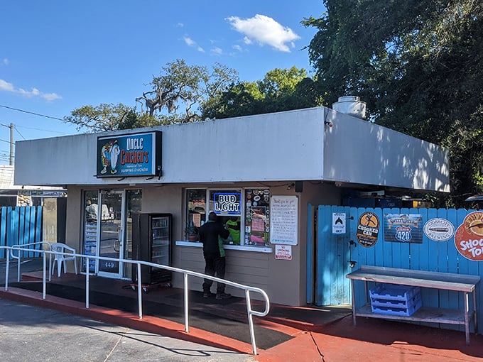The bright blue fence at Uncle Chicken's isn't just eye-catching—it's nature's way of saying "extraordinary food happens here." No fancy frills, just flavor paradise waiting.