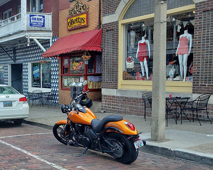 The vibrant storefront of O'Betty's beckons hungry passersby with its cheerful red awning and orange motorcycle parked out front—Athens' version of a culinary bat signal.