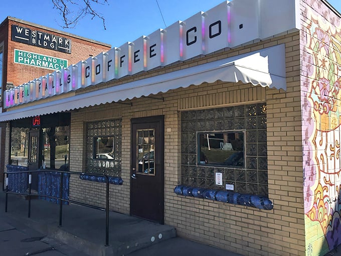 The iconic yellow brick exterior of Angel Falls Coffee Co. stands as a beacon of caffeinated hope in Akron's Highland Square neighborhood.