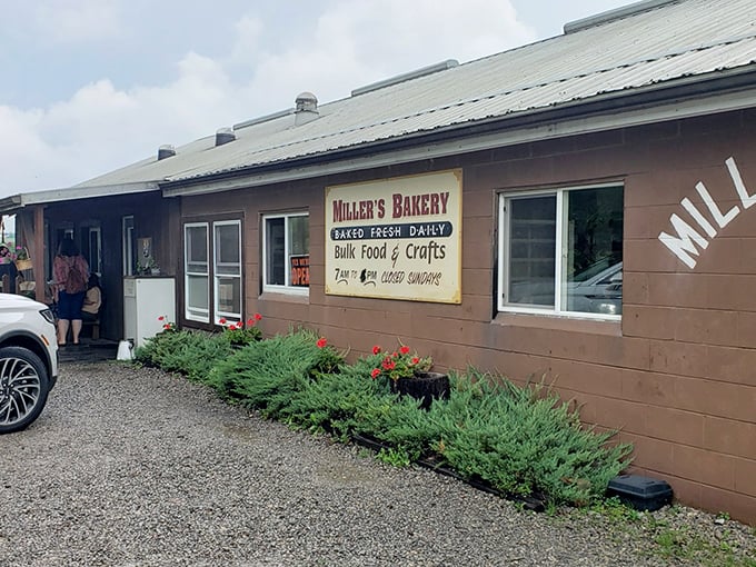 The unassuming exterior of Miller's Bakery proves once again that culinary treasures often hide in plain sight. Those red flowers aren't just decoration—they're nature's way of saying "stop here!"