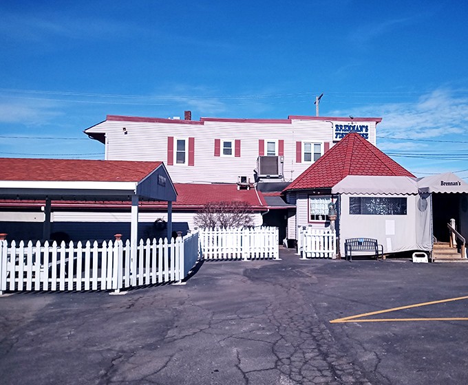 The unassuming exterior of Brennan's Fish House stands like a maritime beacon in Grand River, complete with a weather vane fish that seems to point toward deliciousness.