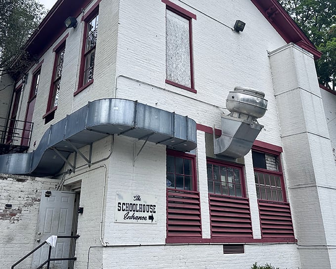 The side view reveals the Schoolhouse's practical charm – where education in flavor replaced arithmetic, and that ventilation system isn't winning beauty contests but sure delivers delicious aromas.