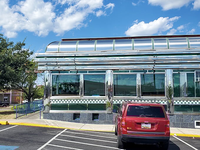 The gleaming stainless steel exterior of Broadway Diner catches the sunset, promising comfort food and nostalgia inside this Baltimore institution.