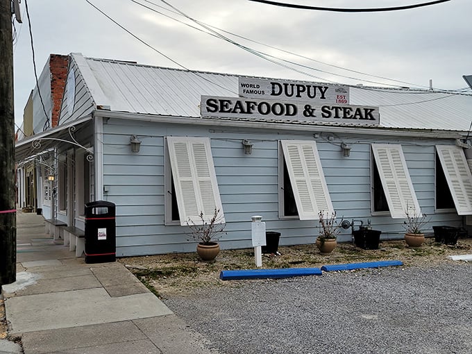 The unassuming white clapboard exterior of Dupuy's is like finding a treasure map in your attic – modest on the outside, but promising untold riches within.