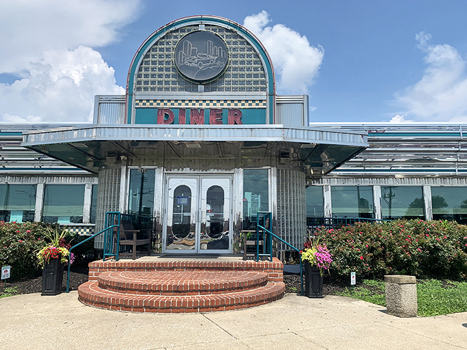 That iconic curved roof and gleaming stainless steel exterior isn't retro chic—it's the real deal, a time capsule of American roadside dining at its finest.
