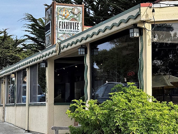 That colorful sign says it all – fresh seafood and pasta await inside. The whimsical fish artwork perfectly captures the playful-yet-serious approach to oceanic delights.