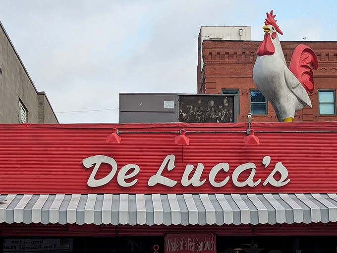 The iconic rooster stands guard atop DeLuca's vibrant red storefront, like a breakfast beacon calling hungry Pittsburghers home.